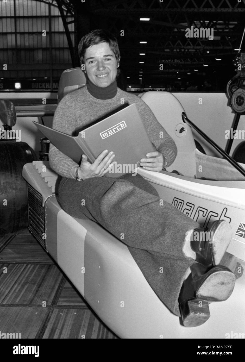 Lella Lombardi, 32, the Italian racing car driver reads the March ...