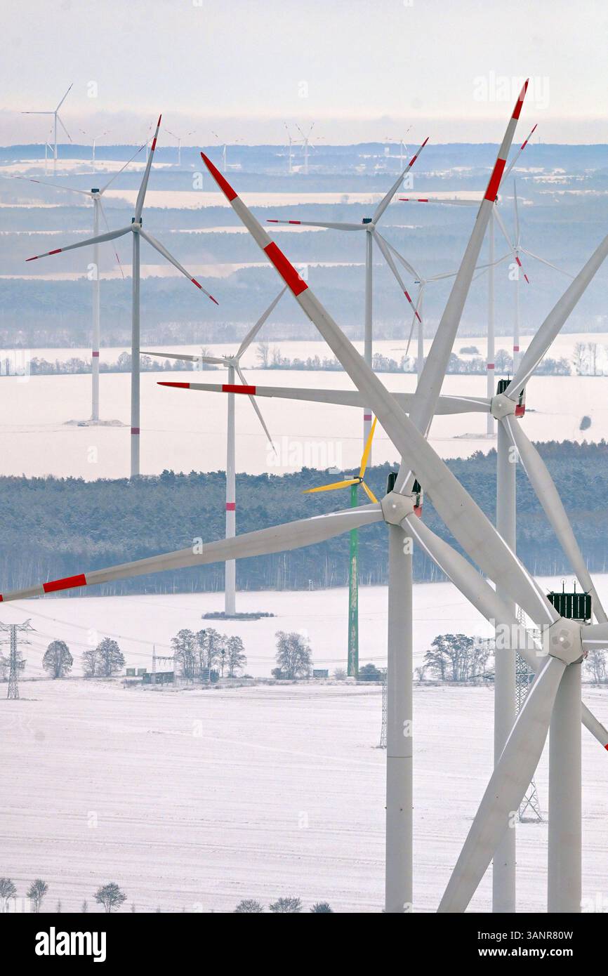 Aerial view of wind power turbines in a beautiful green landscape ...