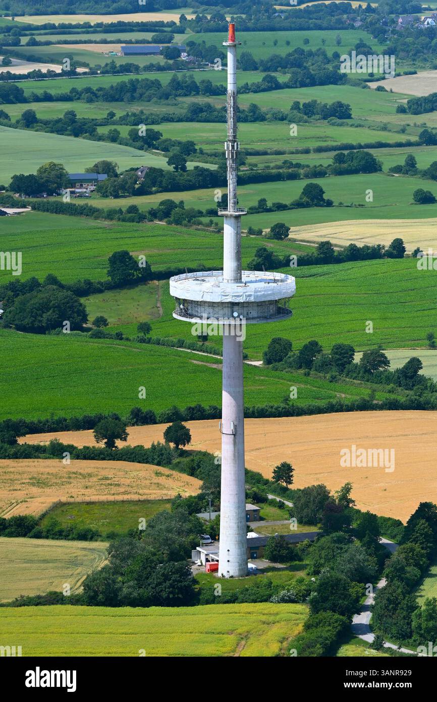 Aerial view of a tranquil landscape featuring a transmission antenna ...