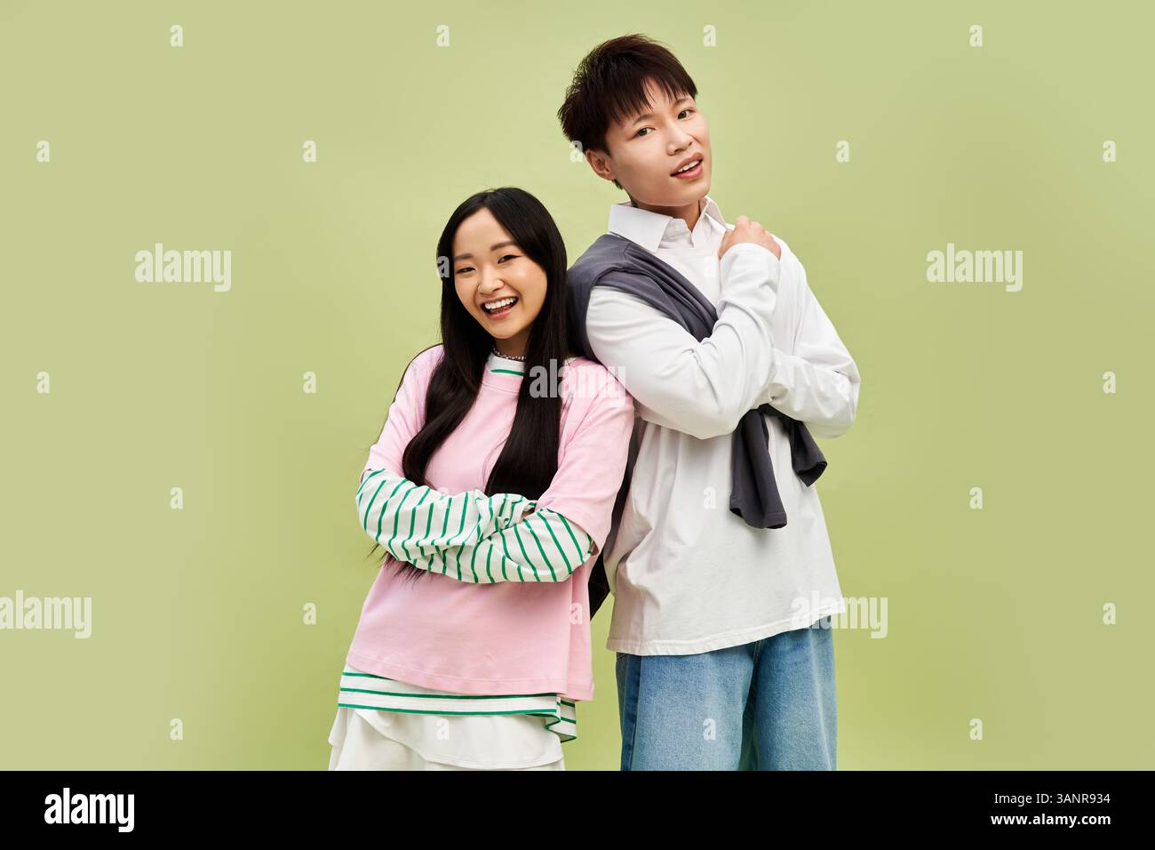 A stylish couple shares a playful moment, celebrating their love in a ...