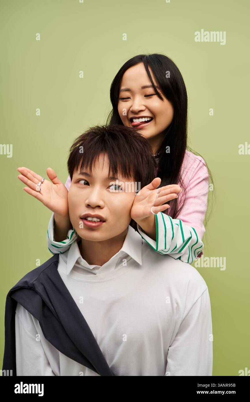 A joyful couple shares a fun moment, highlighting their love and style ...