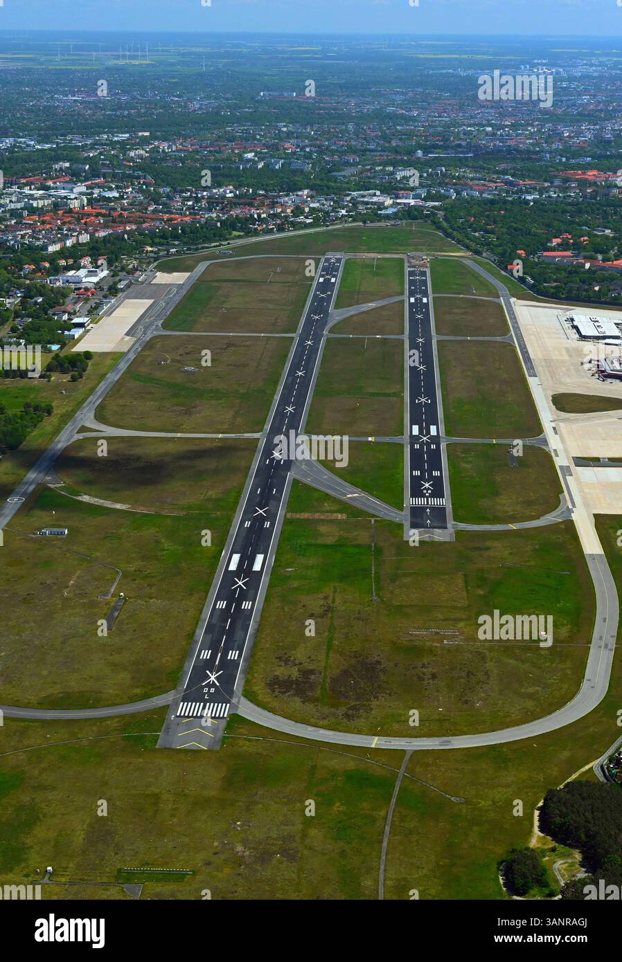Aerial view of Tegel Airport with runways and terminal buildings ...