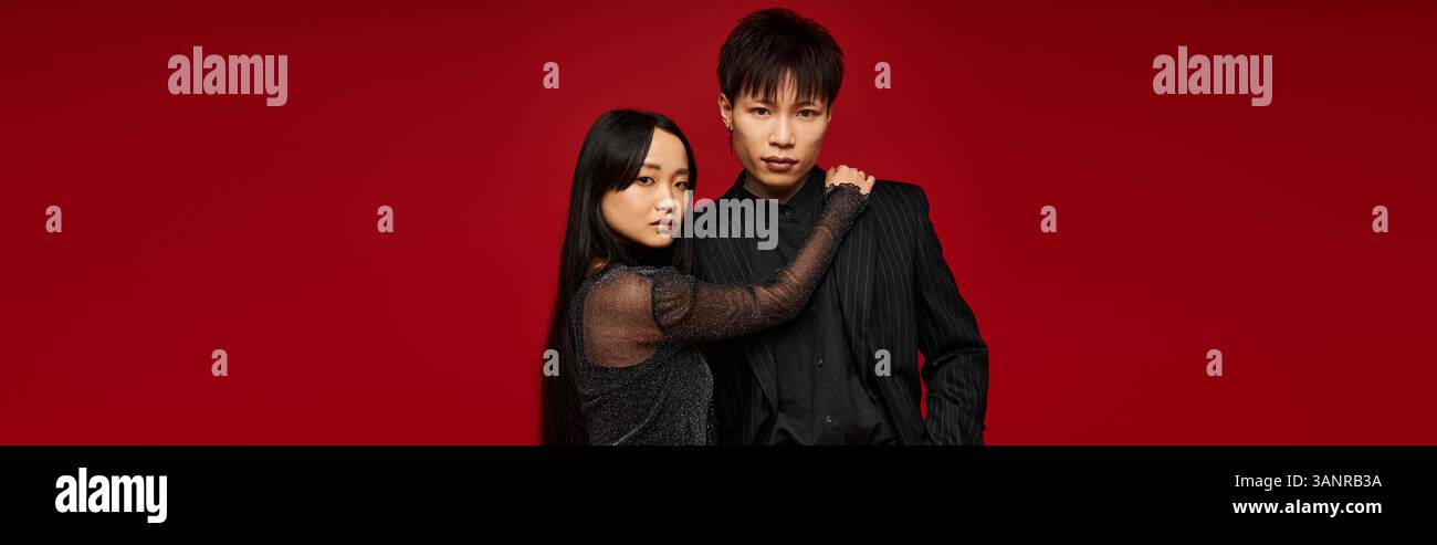 Stylish couple embraces each other, exuding romance and elegance in a ...