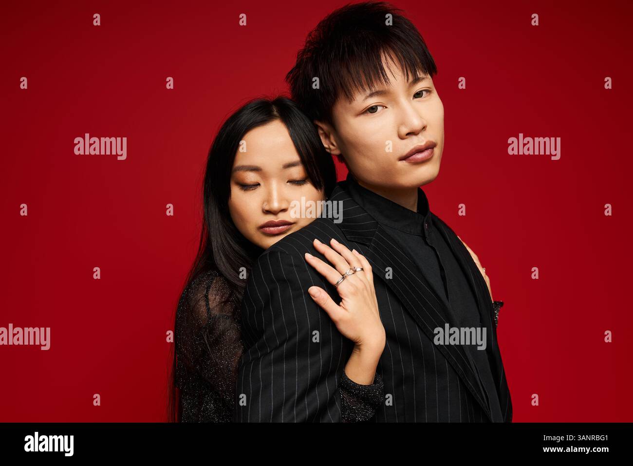 A couple shows off their stylish outfits and love for each other in a ...