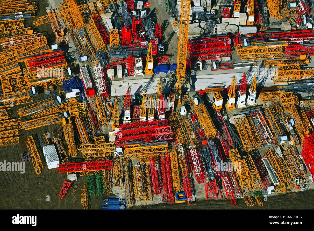Aerial view of colorful factory crane parts and heavy machinery at an ...