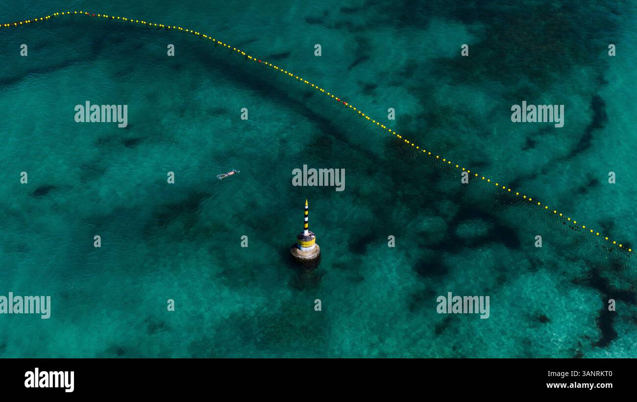 Aerial view of Cottesloe Beach with shark net and turquoise ocean ...