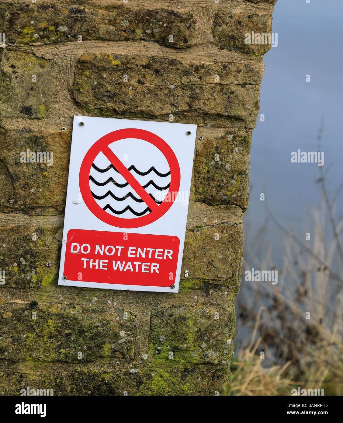 A warning sign saying 'do not enter the water', England, UK Stock Photo ...