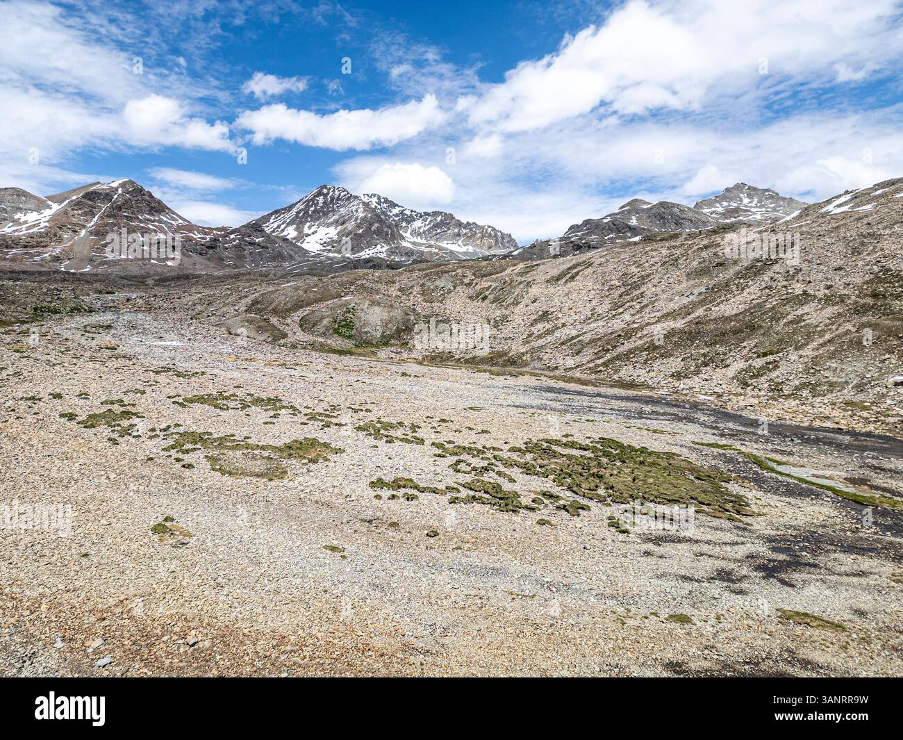 Aerial view of breathtaking snow-capped mountains and vast rugged ...