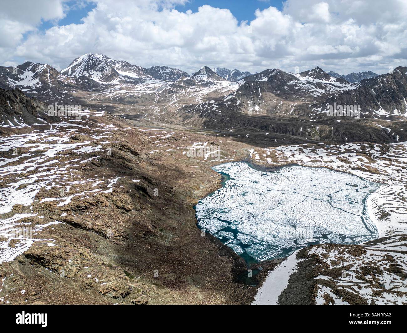 Aerial view of breathtaking glaciers and majestic mountains under a ...