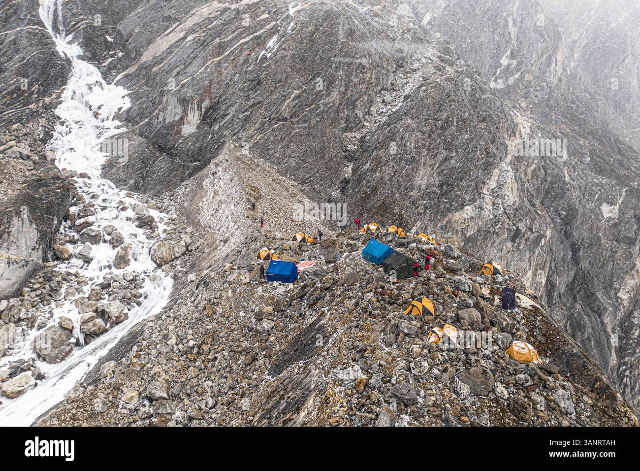 Aerial view of rocky terrain and glacier campsite in Rolwaling valley ...