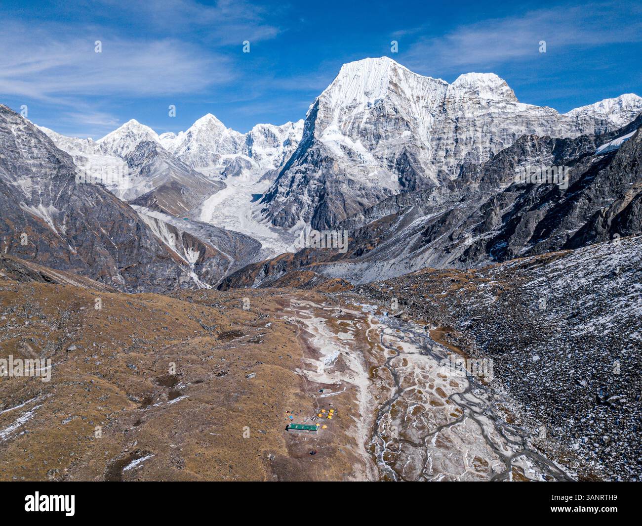 Aerial view of majestic snowy mountains and serene valley at Camp site, Yalung la pass, Landung ...