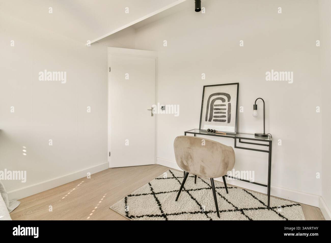 A clean and modern workspace featuring a stylish chair and desk set in ...