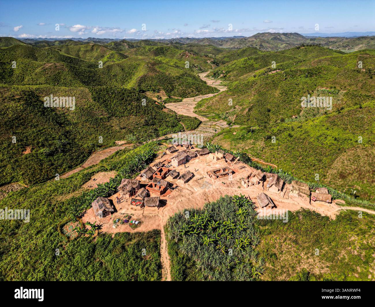 Aerial view of village, rice fields, hills, and valley in Sakaleona ...