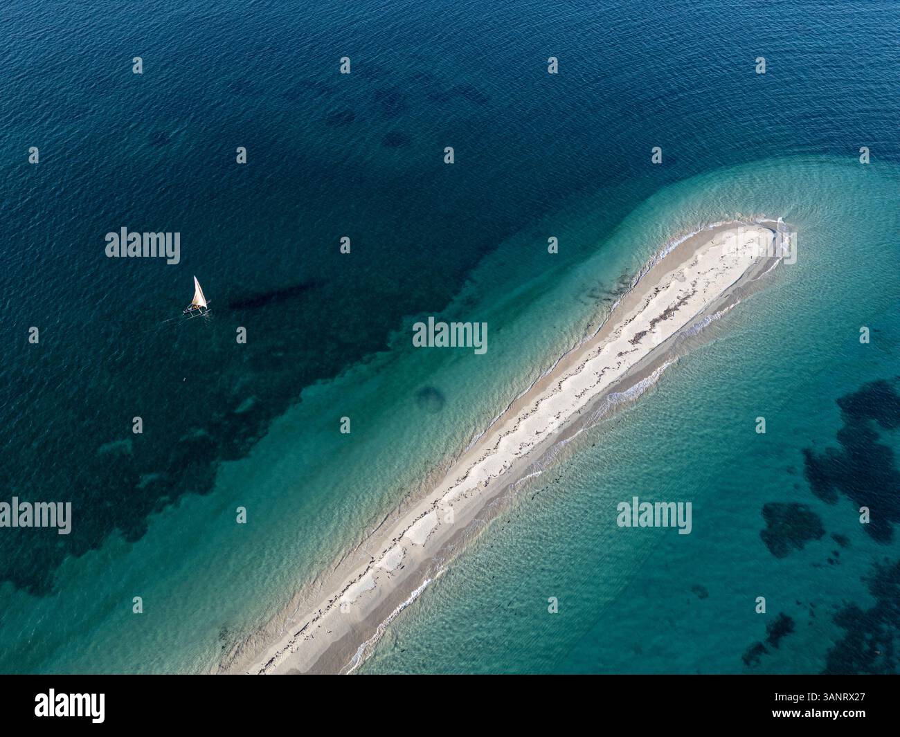 Aerial view of Nosy Lava Island with outrigger canoe and sandy ...