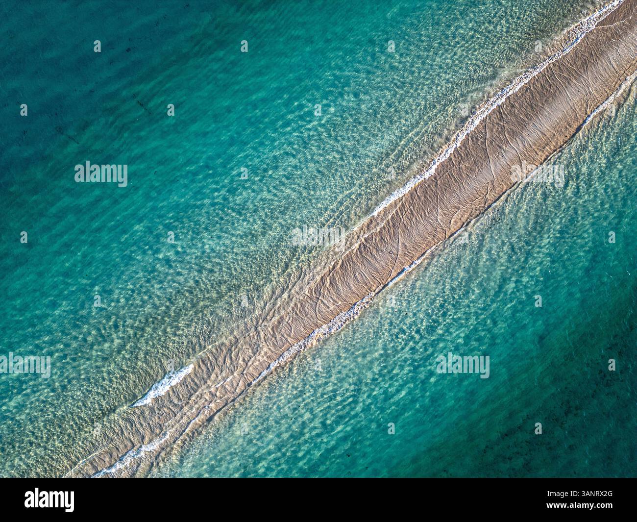 Aerial view of Nosy Lava Island, crystal clear ocean and pristine sand ...