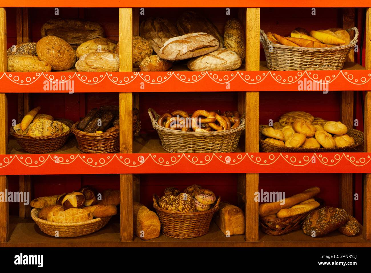 The image displays a variety of freshly baked bread and pastries on ...