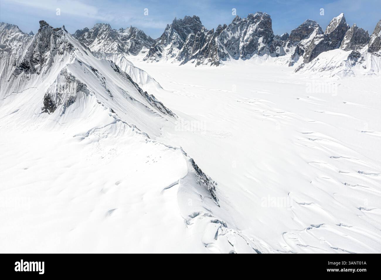 Aerial view of snow-covered landscape with Lukpe La Pass and Solu Tower ...