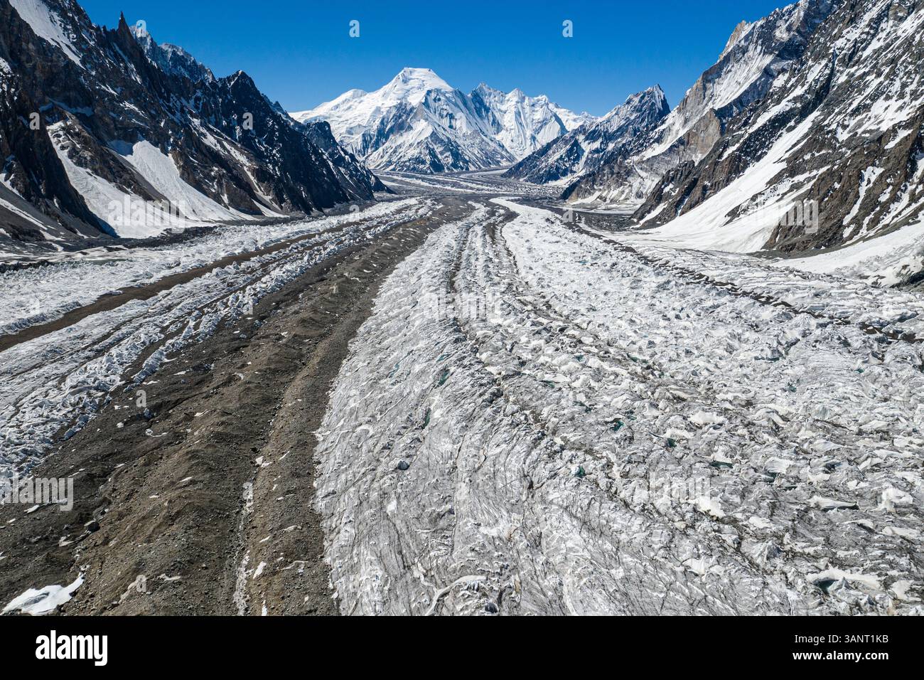 Aerial view of frozen Godwin Austen glacier and snow-capped peaks in ...