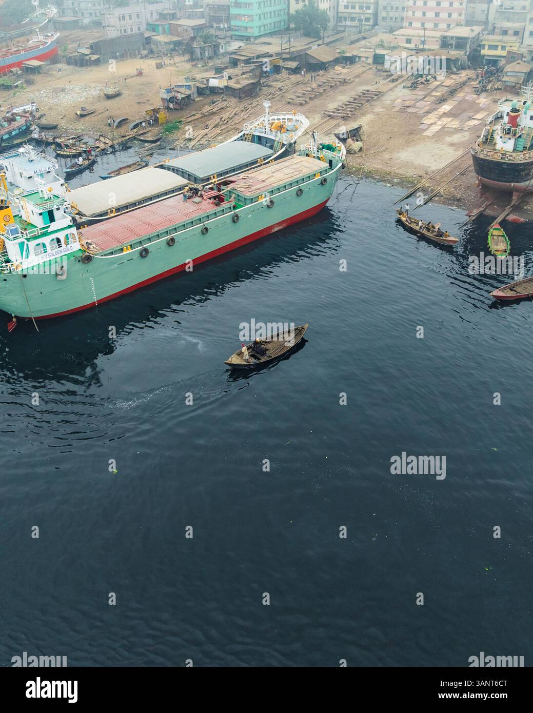 Aerial view of shipyard on Buriganga river with cargo ships and boats ...