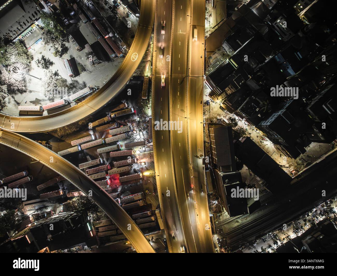 Aerial view of bustling urban night scene with vibrant city lights and ...