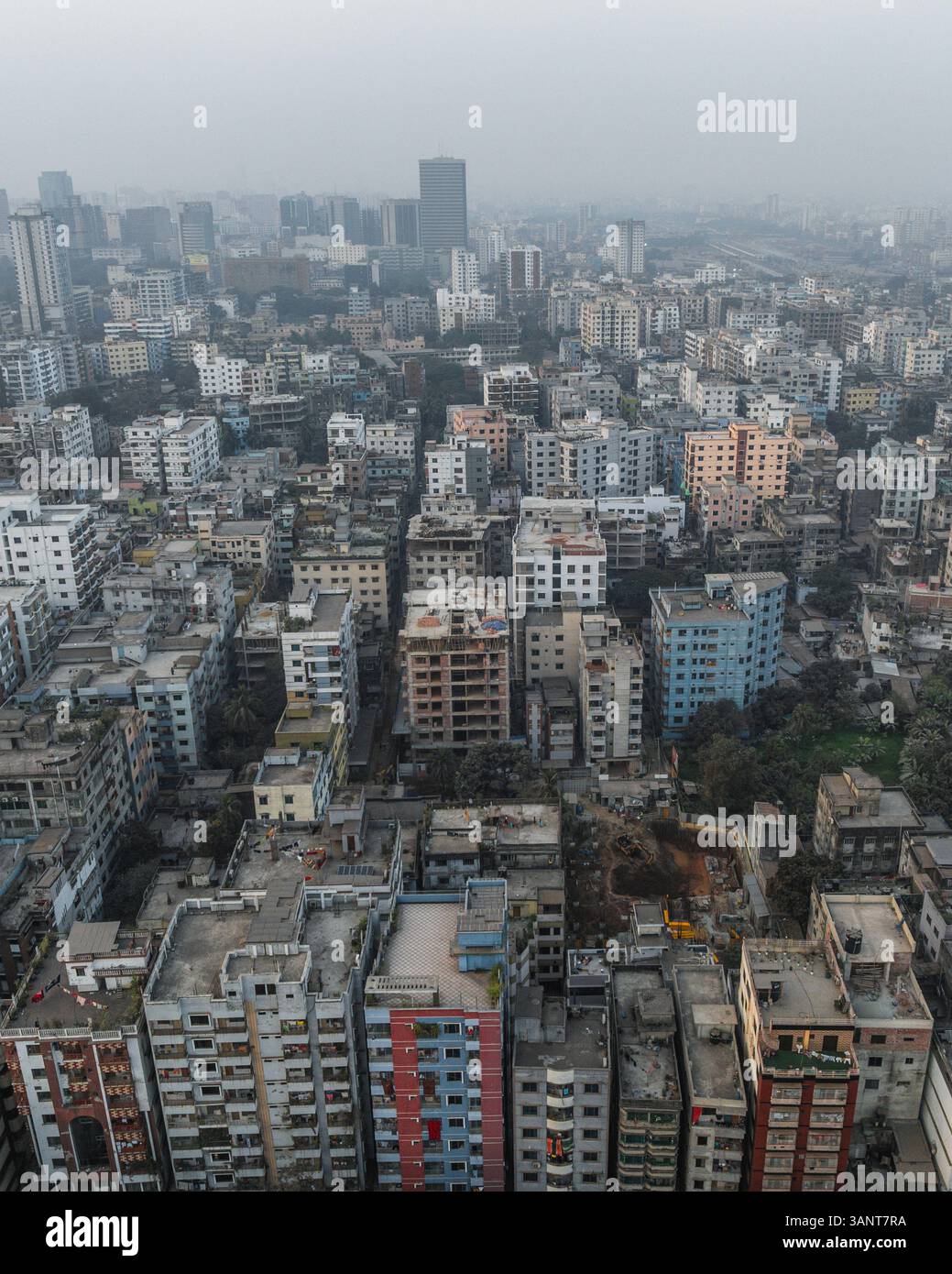 Aerial view of dense urban skyline with high-rise buildings and crowded ...