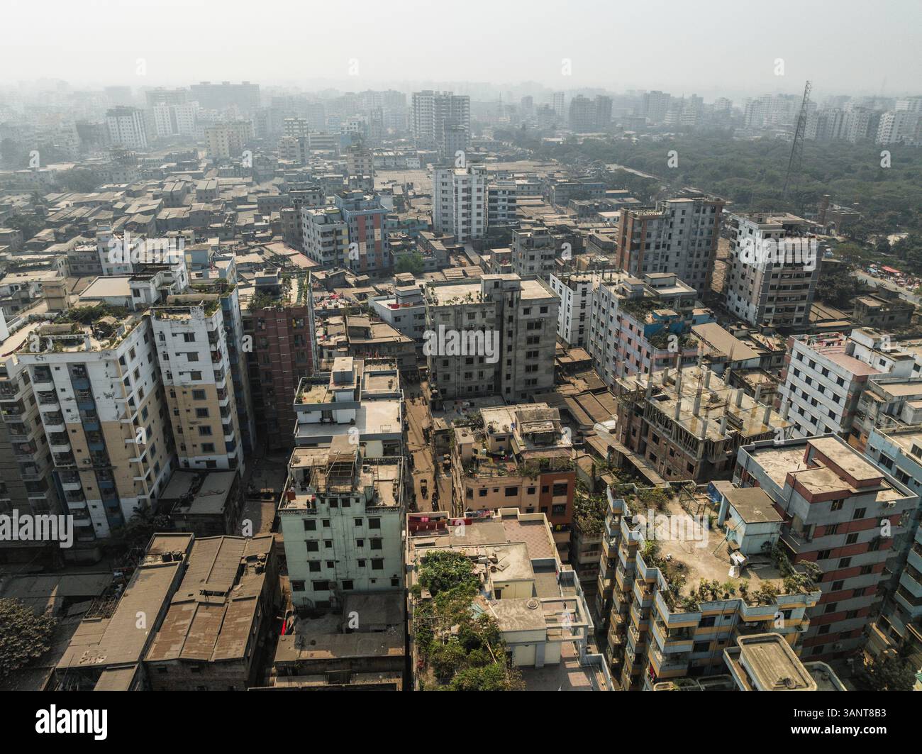 Aerial view of urban cityscape with high-rise buildings and rooftops ...