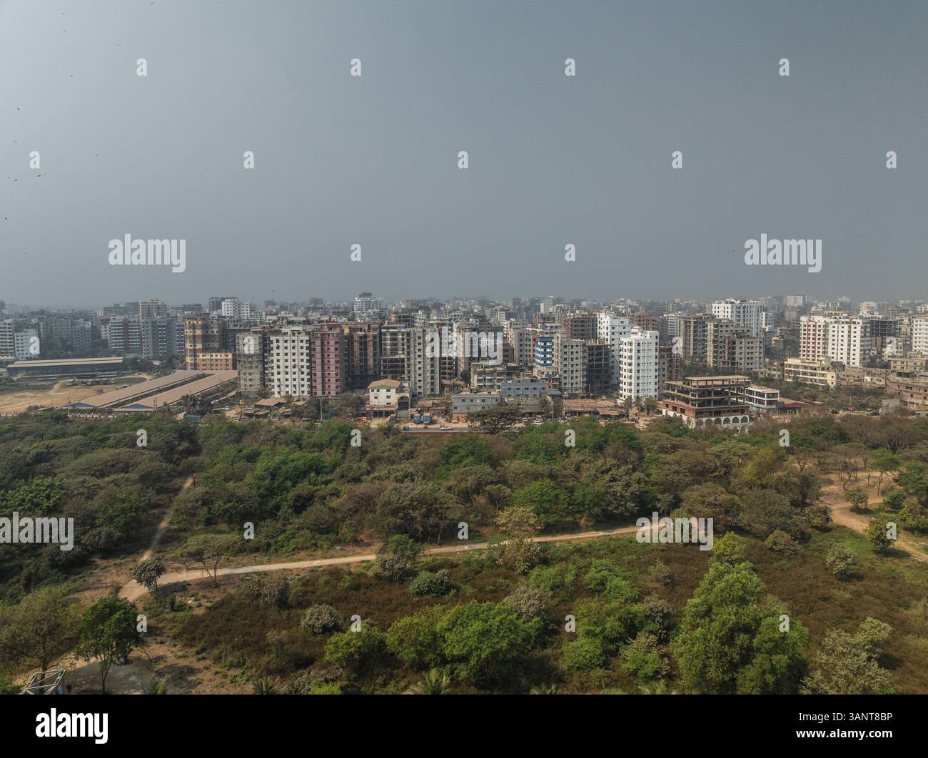 Aerial view of urban skyline with modern buildings and greenery ...