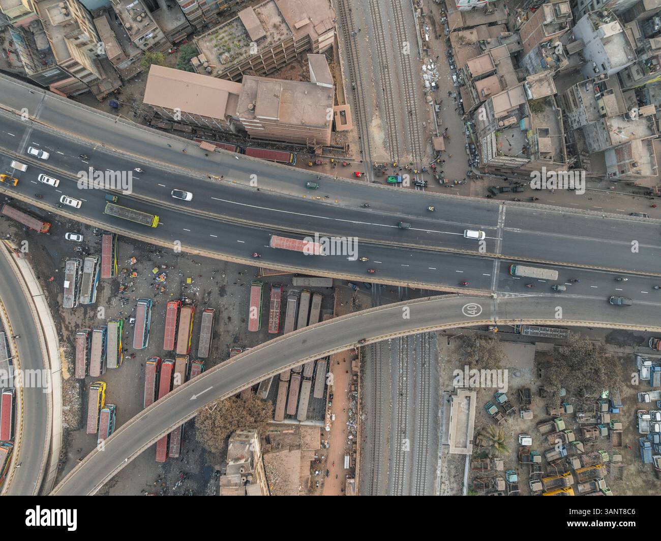 Aerial view of busy junction road and bus station with vehicles and ...