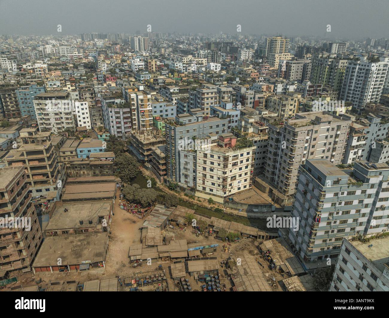 Aerial view of crowded residential buildings and urban skyline, Mohammadpur Upazila, Dhaka ...