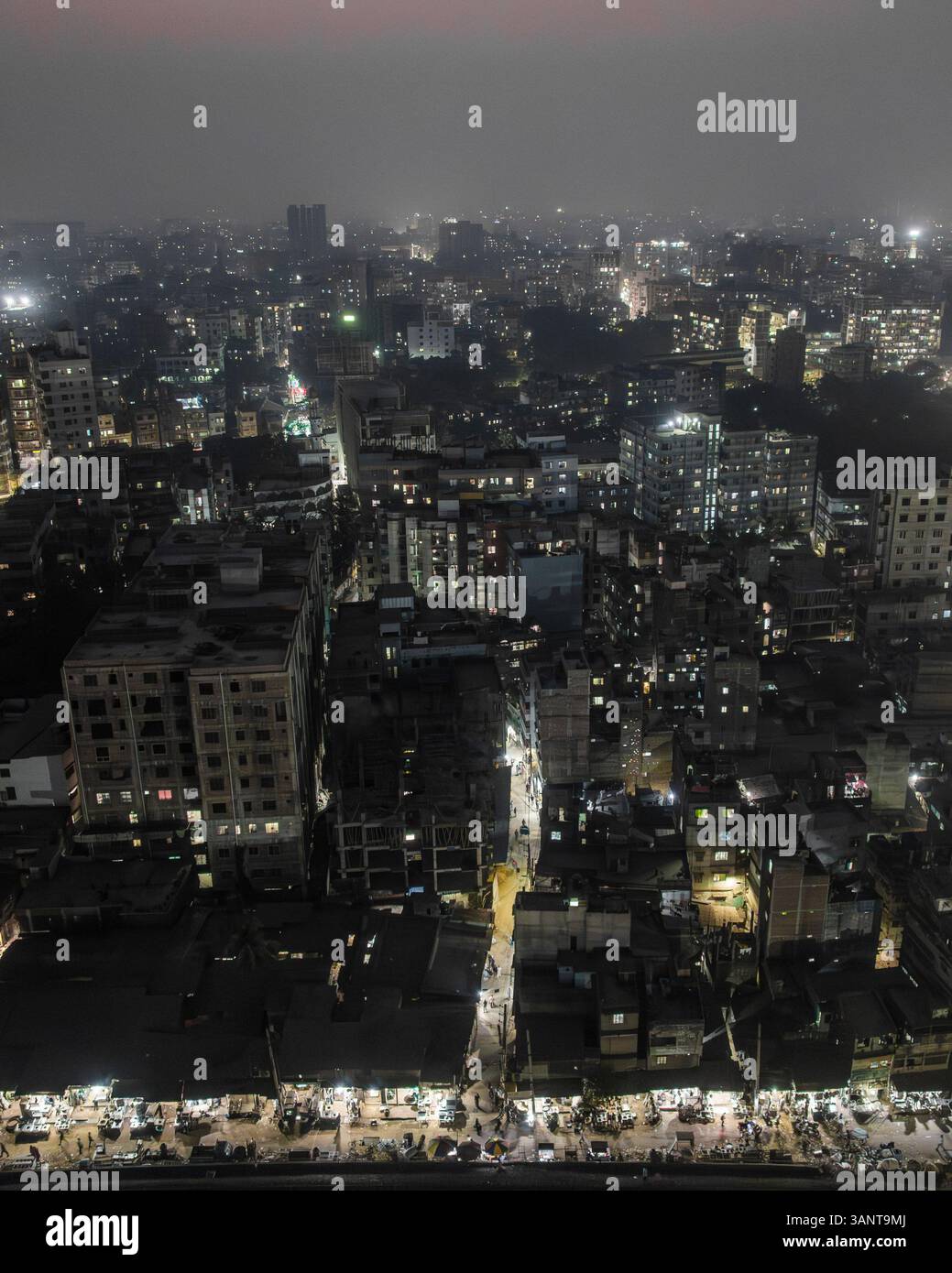 Aerial view of beautiful cityscape at night with modern buildings and ...