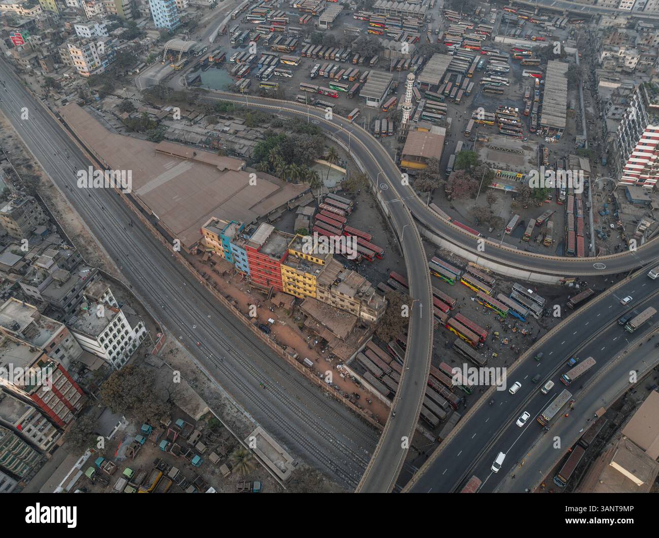 Aerial view of bustling urban landscape with busy roads and traffic, Gendaria, Dhaka, Bangladesh ...