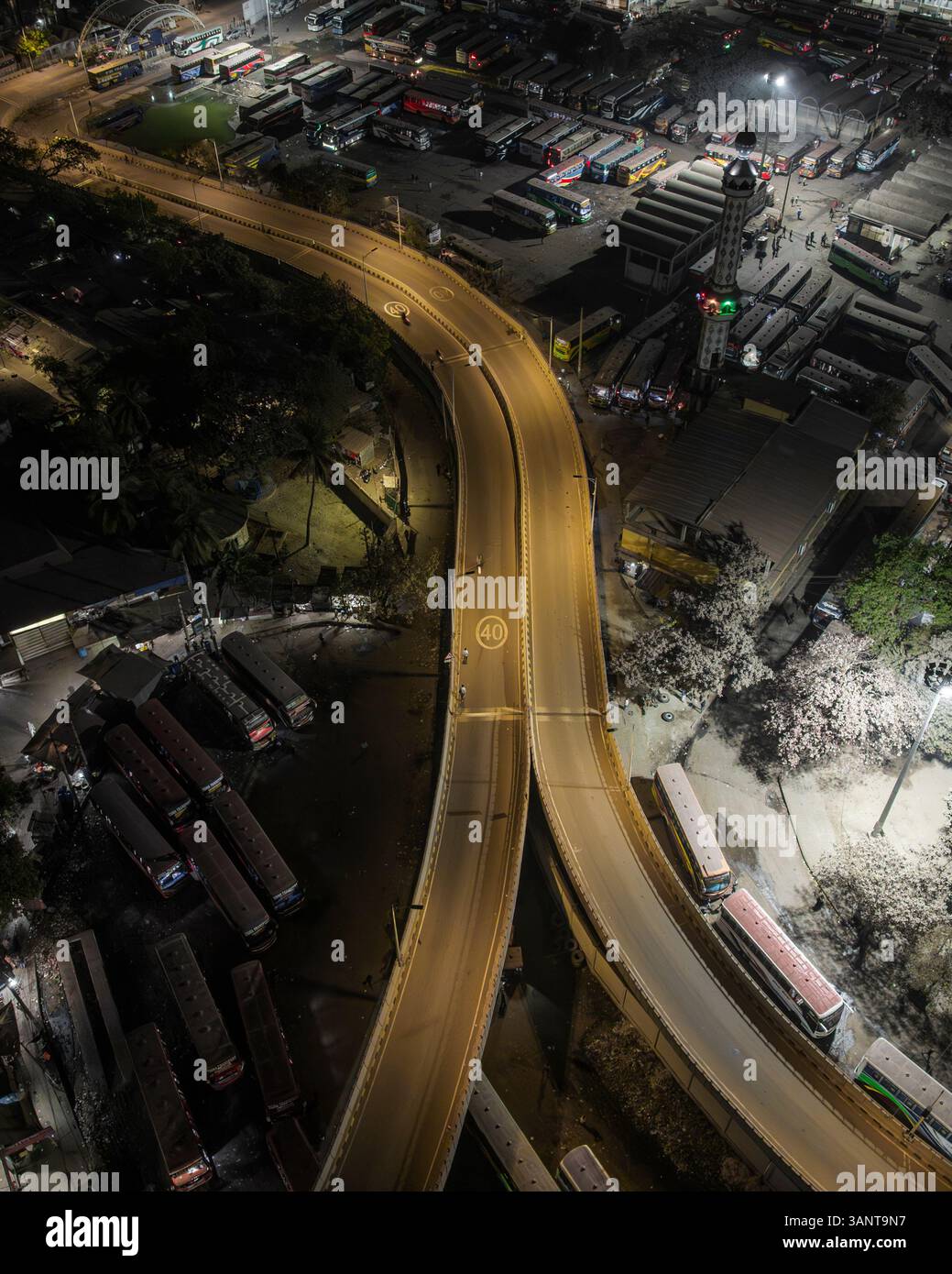 Aerial view of bustling urban landscape with busy roads and vibrant city lights, Gendaria, Dhaka ...