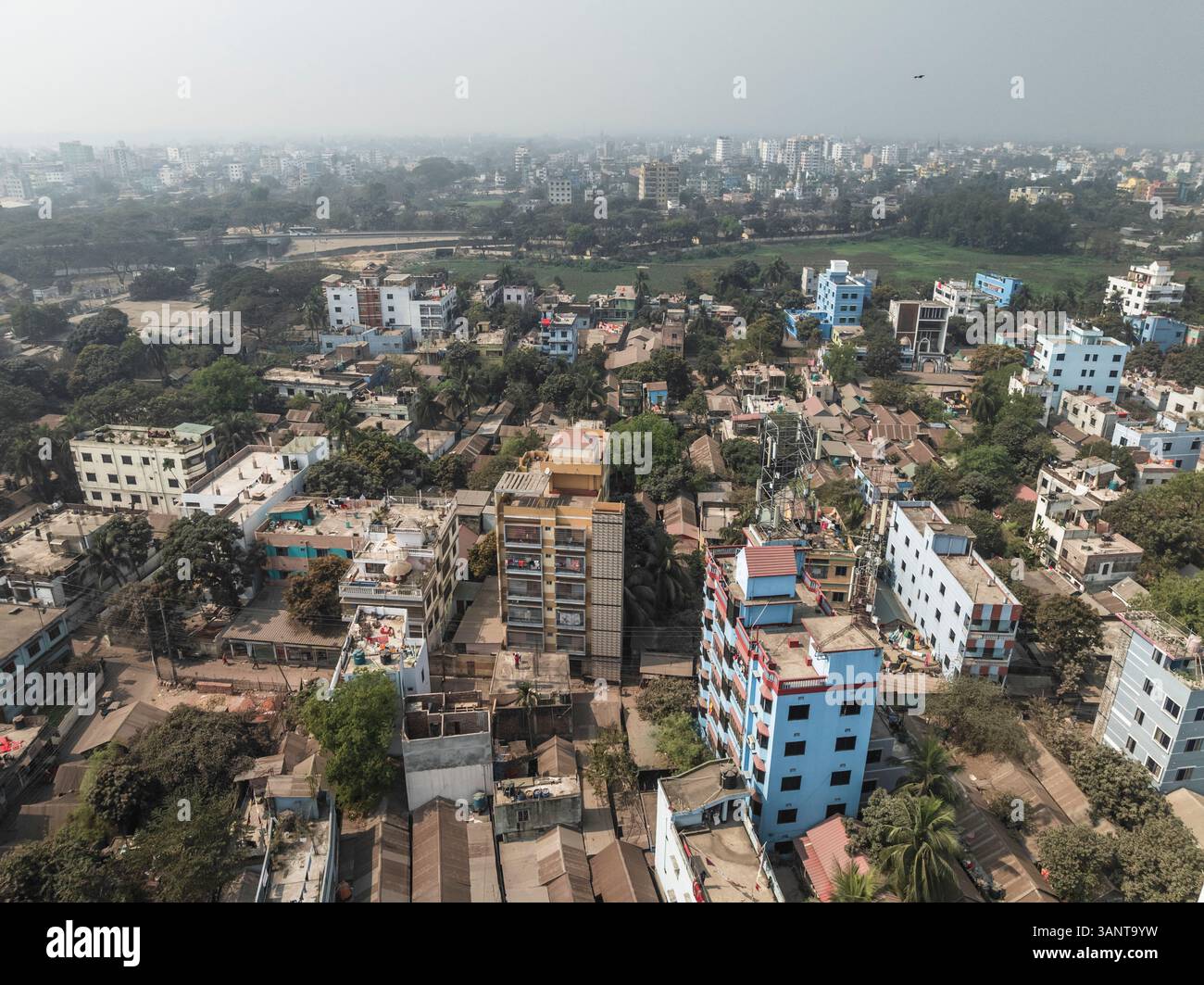 Aerial view of vibrant cityscape with dense residential buildings and ...