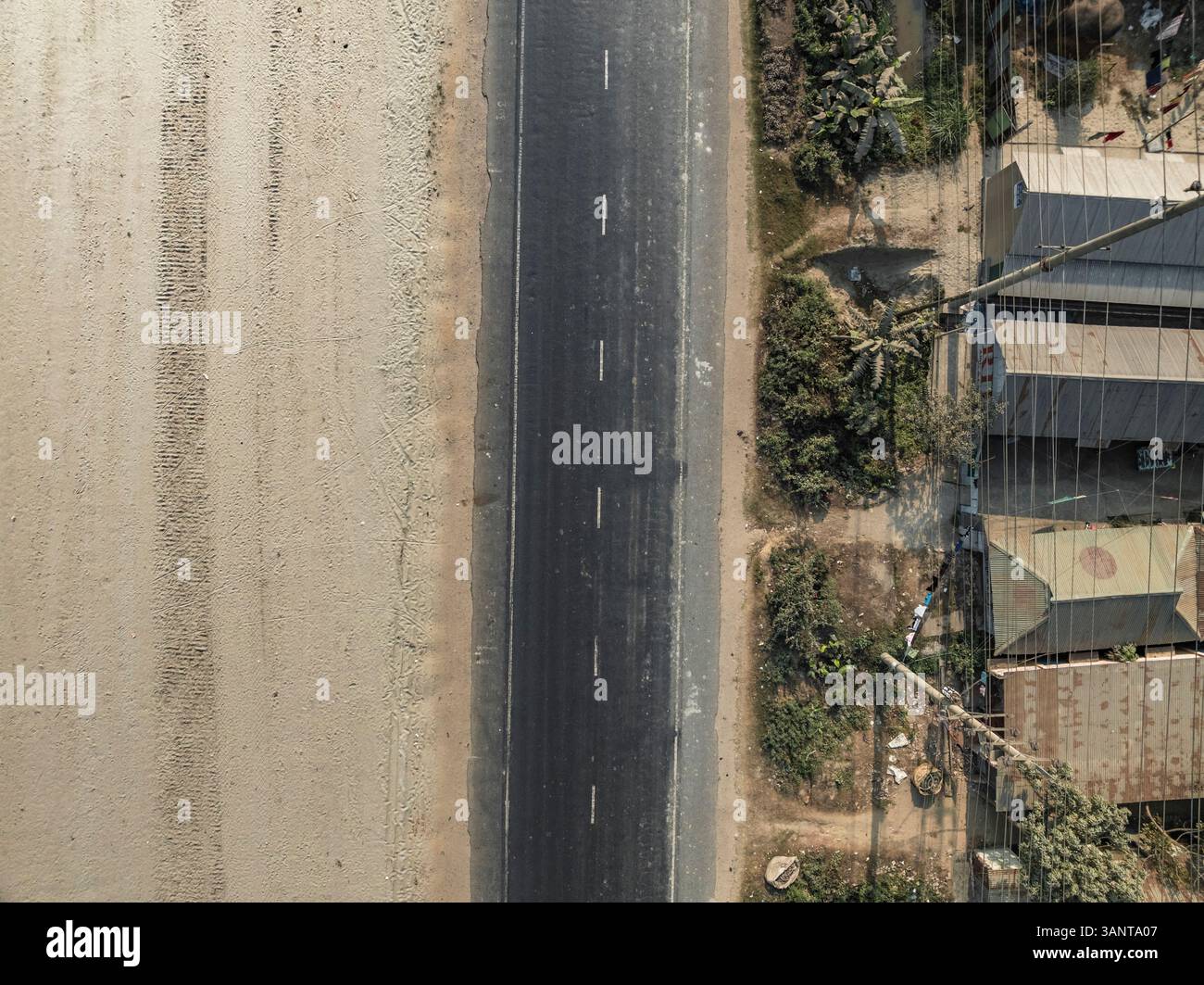 Aerial view of urban residential area with houses, roads, and greenery ...