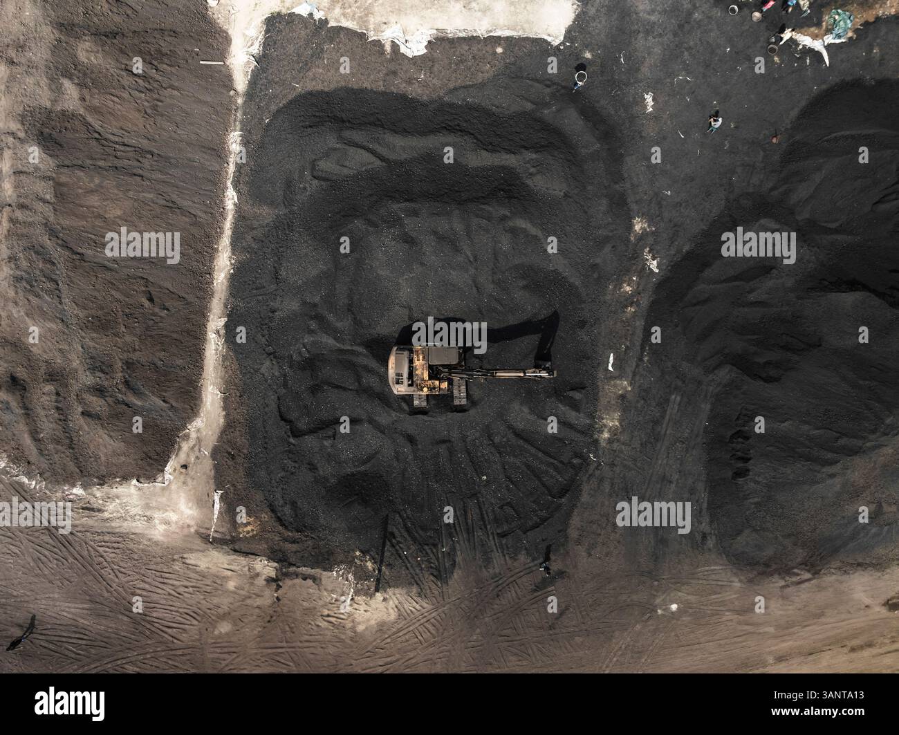 Aerial view of industrial coal factory with cranes and heavy machinery ...