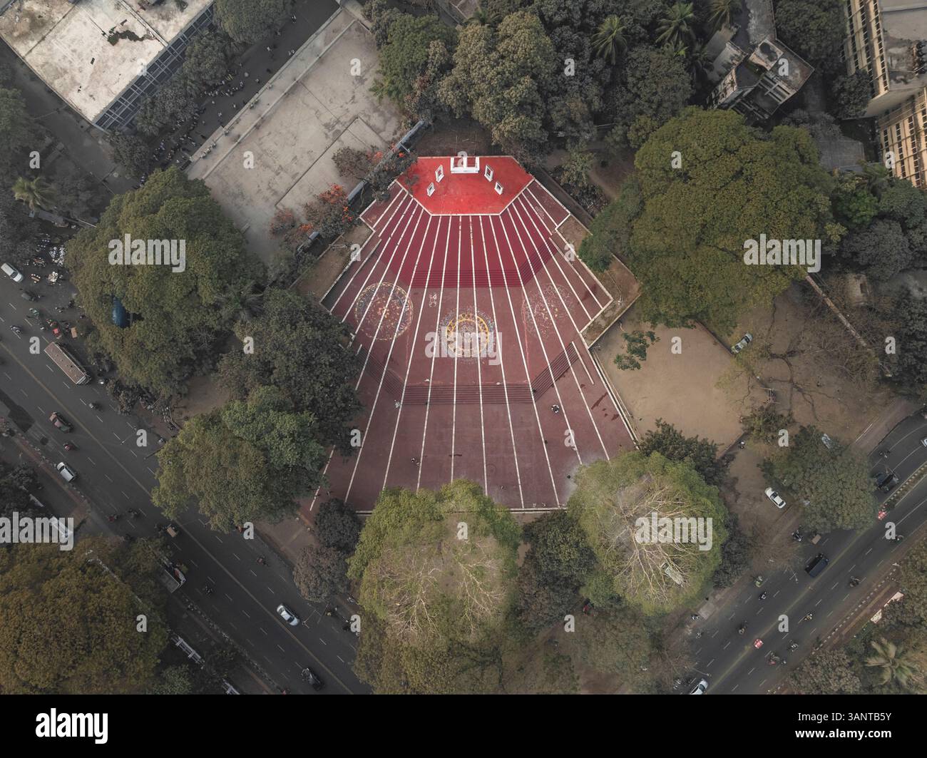 Aerial view of central shaheed minar surrounded by greenery and urban ...