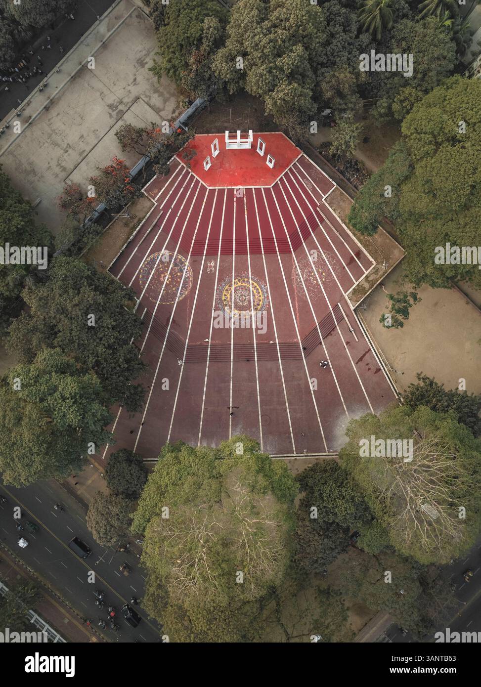 Aerial view of central shaheed minar surrounded by greenery and urban ...