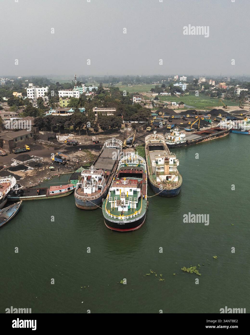 Aerial view of the Meghna River with boats and a coal factory, Bhairab ...