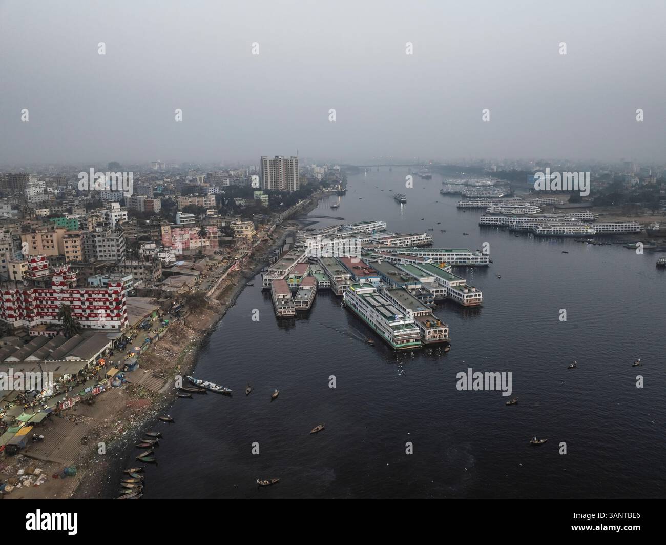 Aerial view of the bustling port along the buriganga river with modern ...