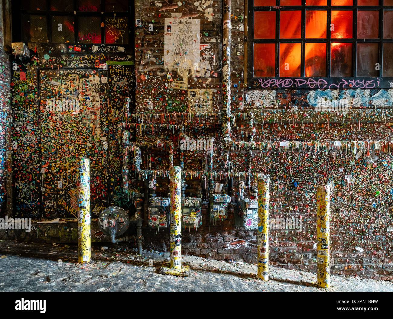 Colorful gum-covered alley wall creating a unique urban art scene in ...