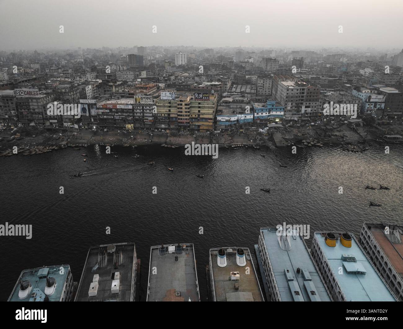 Aerial view of Sadar Ghat and Buriganga River with modern buildings and ...