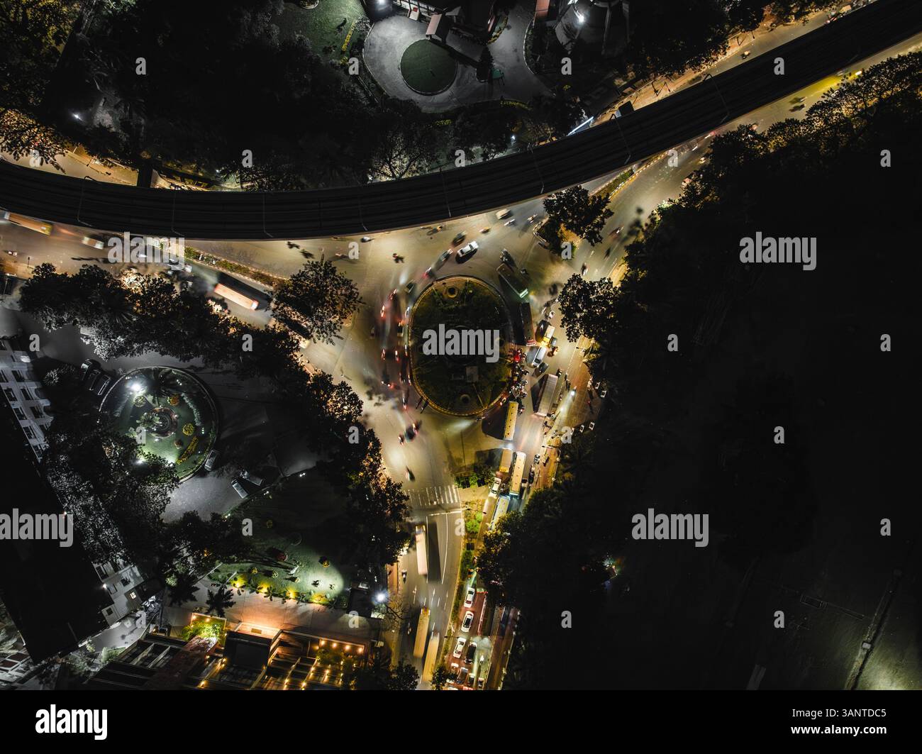 Aerial view of vibrant cityscape with illuminated buildings and busy ...