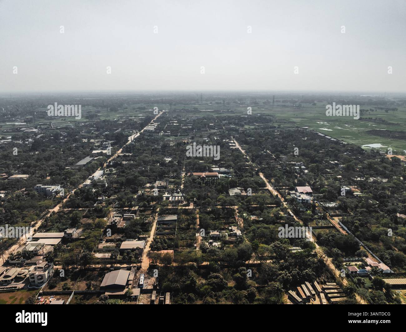 Aerial view of urban landscape with buildings, roads, and greenery in ...