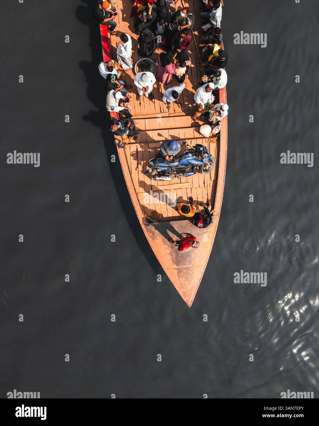 Aerial view of busy Dhaleshwari River with wooden boats and a crowd of ...