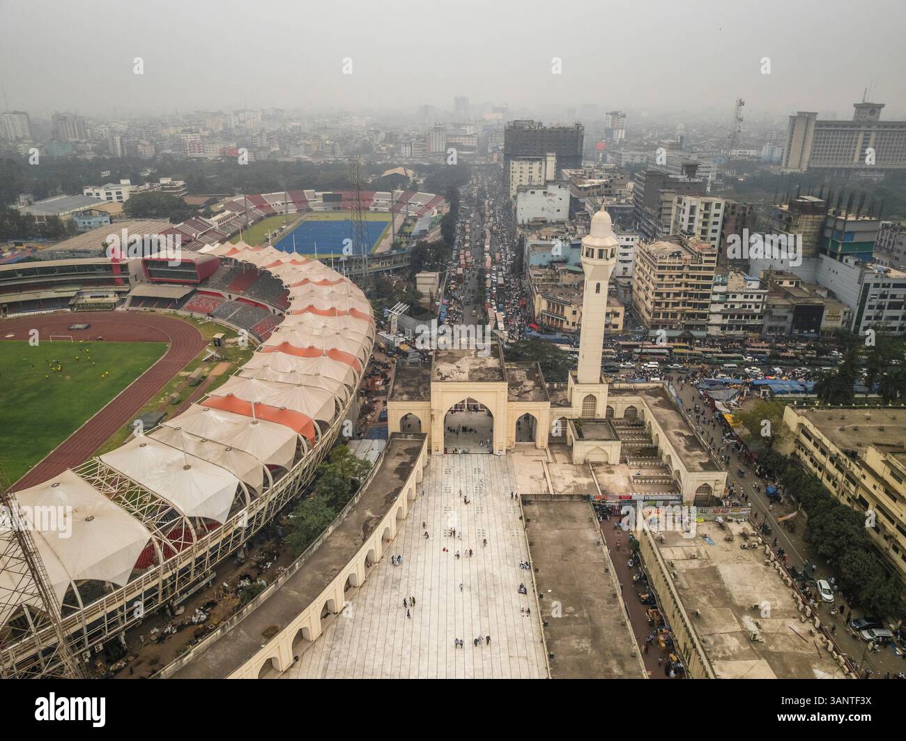 Aerial view of baitul mukarram national mosque surrounded by urban ...