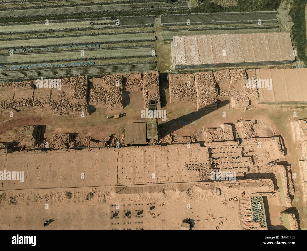 Aerial view of industrial brick fields and factories amidst ...