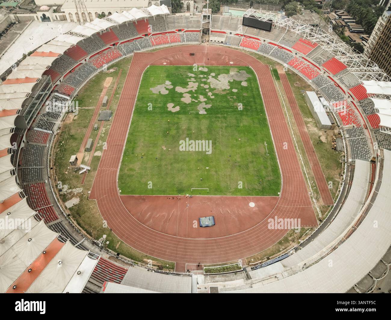 Aerial view of Bangladesh National Stadium with green field and red ...