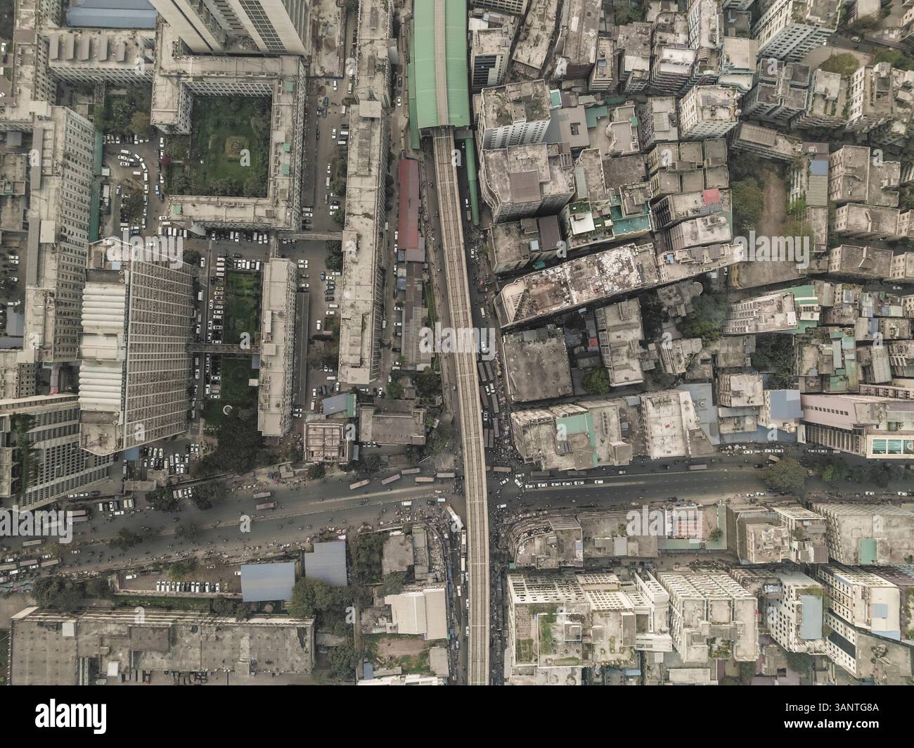 Aerial view of bustling railway and dense urban landscape with ...