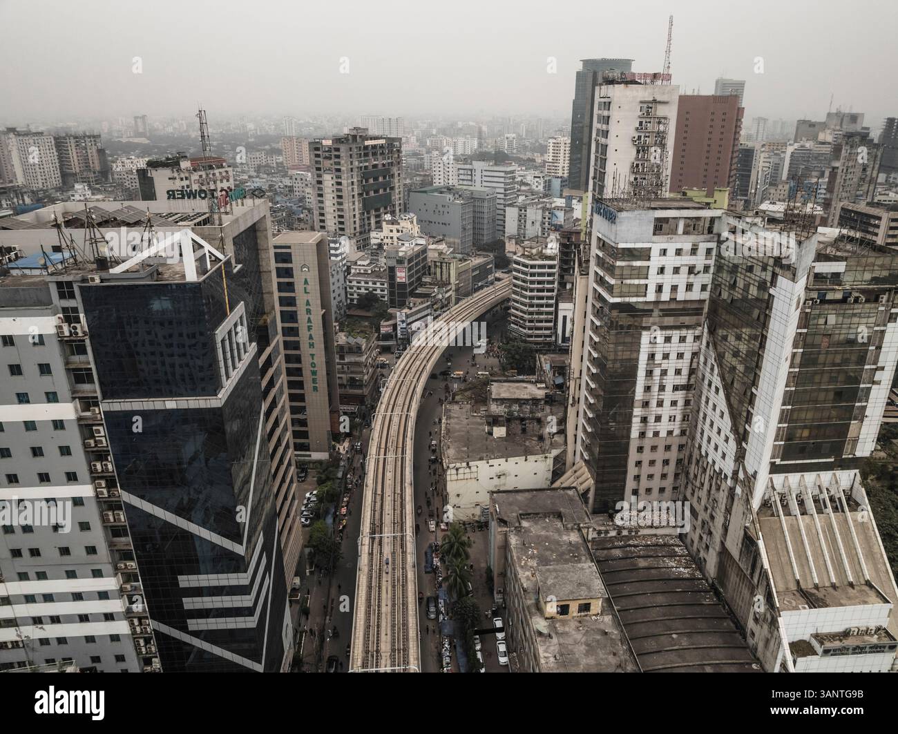 Aerial view of bustling cityscape with modern skyscrapers and railway ...