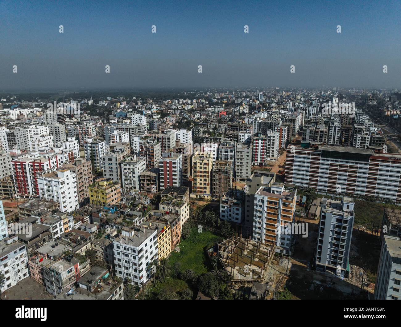 Aerial view of modern urban cityscape with high-rise buildings and densely populated apartments ...